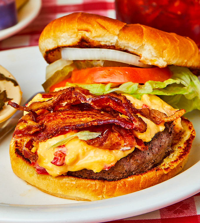 This isn't just a burger—it's a Southern negotiation between beef, pimento cheese, and bacon where everybody wins, especially you.