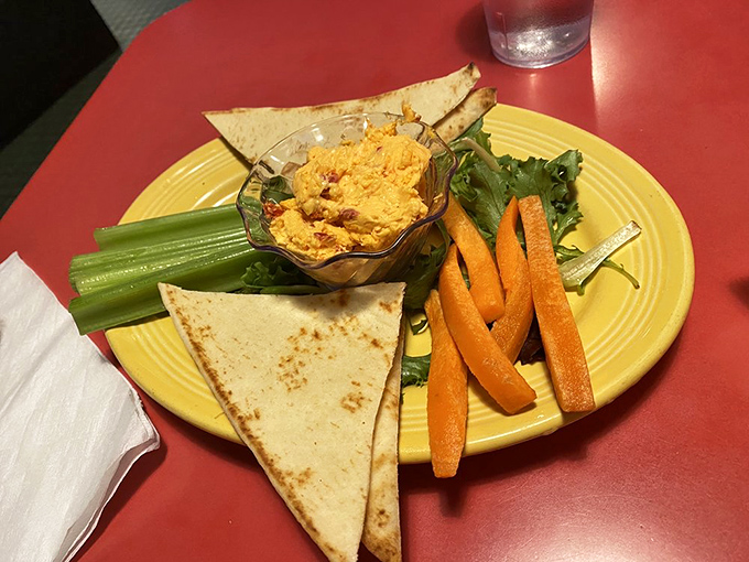 Pimiento cheese &ndash; the caviar of the South &ndash; served with fresh vegetables and triangles of pita. Simple pleasures elevated to art.