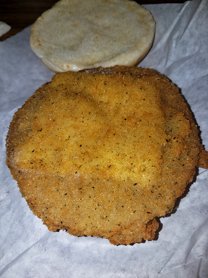 The tenderloin sandwich—breaded, fried, and hanging gloriously off the bun as Midwest tradition demands. A beautiful golden disc of happiness.