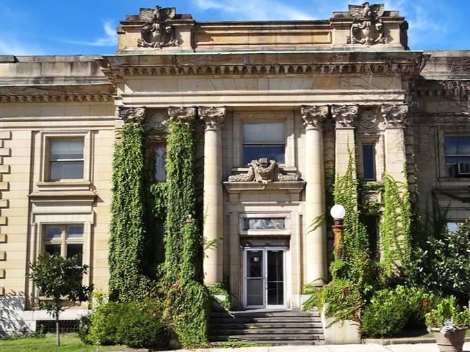 Ivy embraces this classical building like nature giving architecture a warm hug, creating a postcard-perfect scene straight out of small-town America's greatest hits.