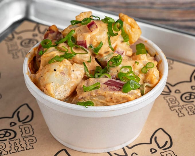 Potato salad that your grandmother would approve of, but with enough personality to stand up to the smokehouse stars. The green onion garnish adds both color and sass.