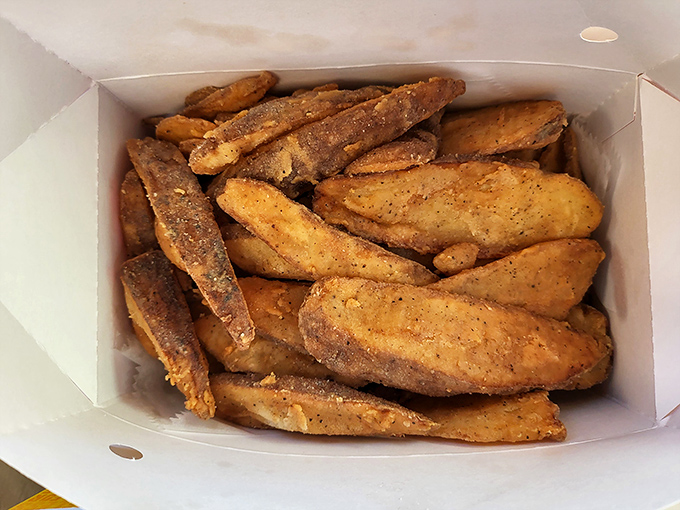 Potato wedges seasoned to perfection—crispy on the outside, fluffy inside. The kind of fries that make you forget ketchup exists.