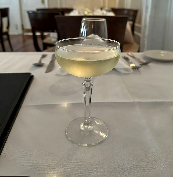 A perfectly chilled glass of prosecco catches the light like liquid gold, promising bubbles of happiness to complement your Italian feast.