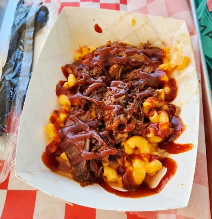 Mac and cheese topped with pulled pork and sauce&mdash;because sometimes comfort food needs its own comfort food. Carb-counting is tomorrow's problem.