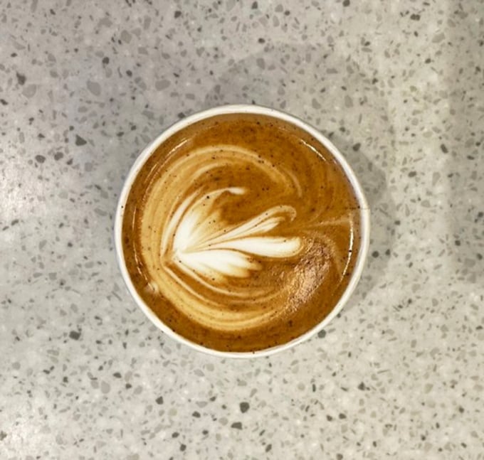 Latte art so pretty you almost don't want to drink it – almost. That leaf design is practically begging for its Instagram moment.