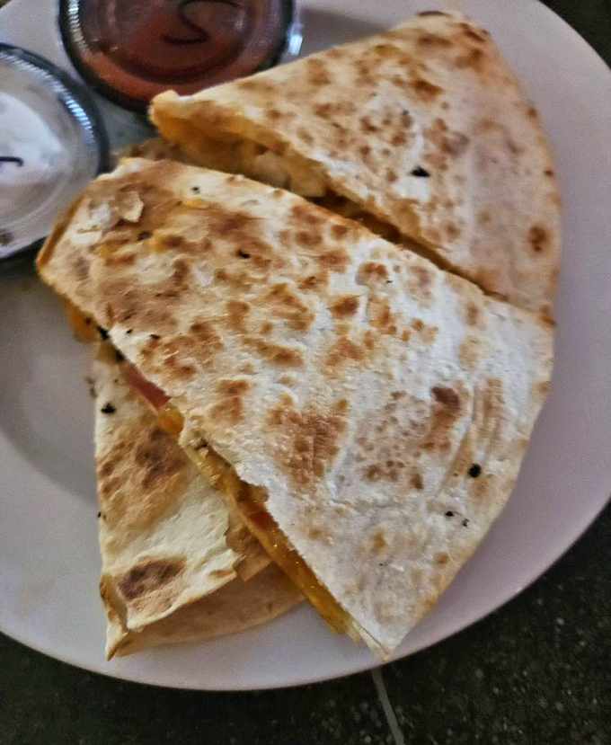 This quesadilla isn't just melted cheese between tortillas; it's a crispy, gooey masterpiece waiting to be discovered.