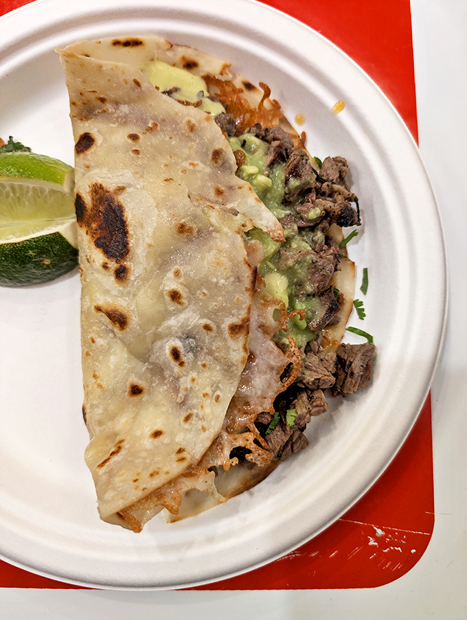 The volcan&mdash;where crispy tortilla meets tender meat and creamy guacamole in a textural symphony that makes your taste buds stand and applaud.