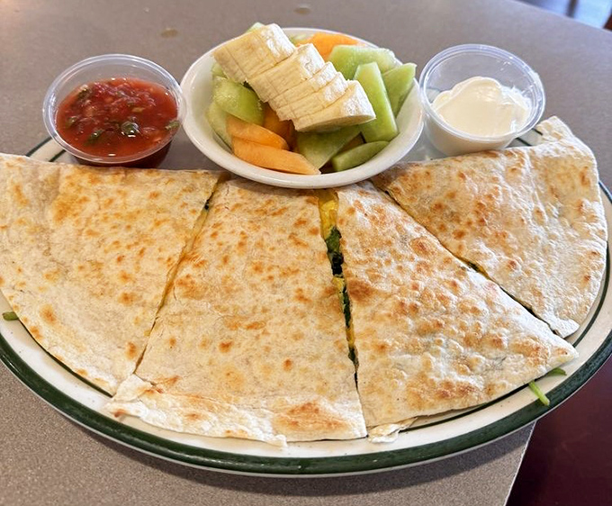Quesadillas with fresh fruit on the side—proof that Hot N Tot understands balance. One part indulgence, one part virtue, all parts delicious.
