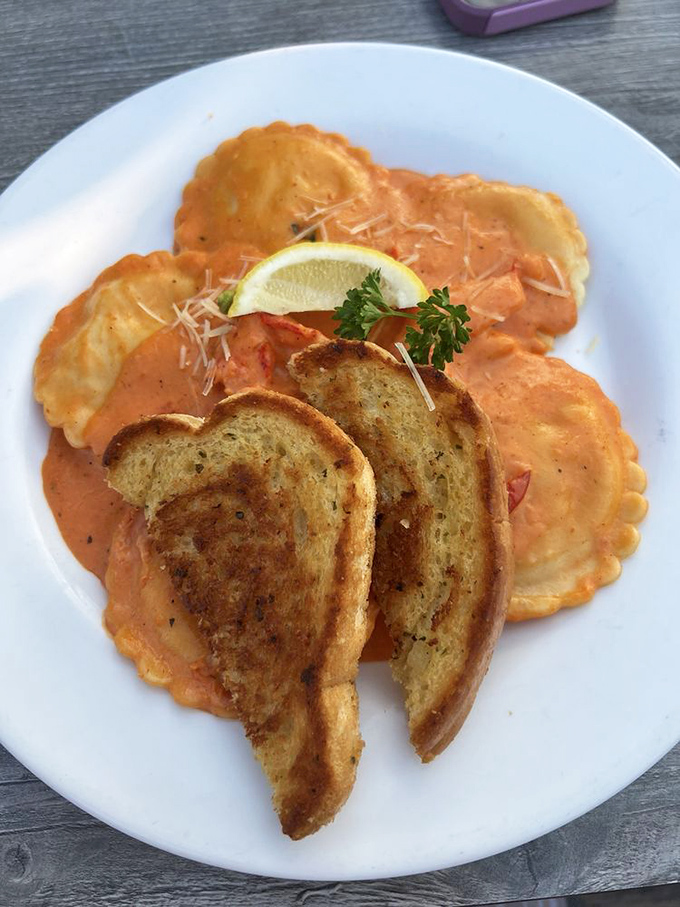Seafood ravioli swimming in a sauce so good you'll be plotting ways to legally obtain the recipe before your plate is empty.