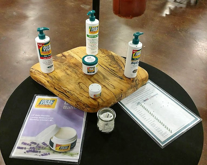 Pain relief products arranged like museum pieces on spalted wood&mdash;proof that even practical purchases can be displayed with artistic flair.