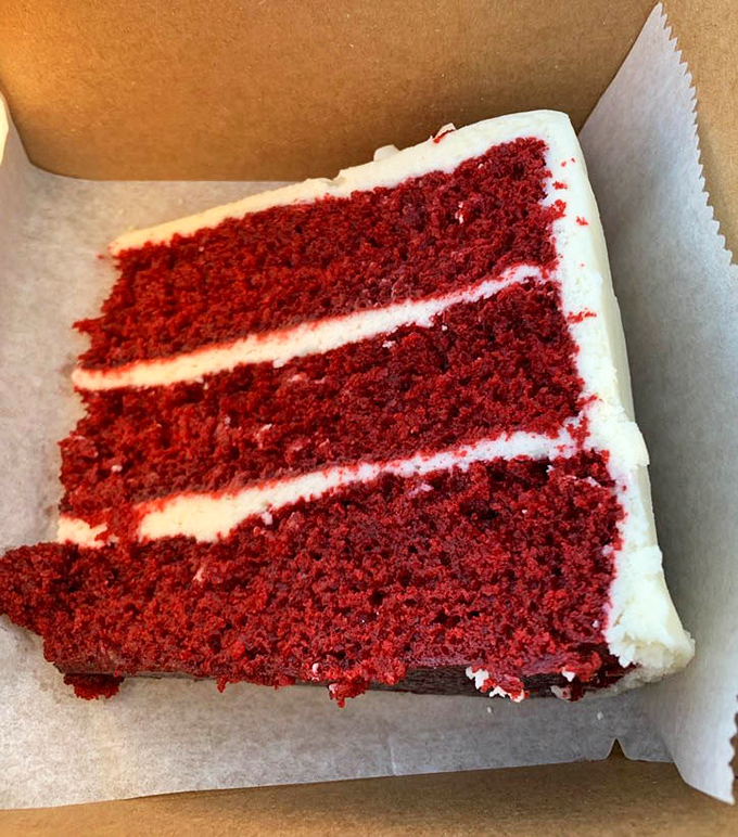 Three perfect layers of red velvet cake with cream cheese frosting so pristine it looks Photoshopped&mdash;but trust me, it's gloriously real.