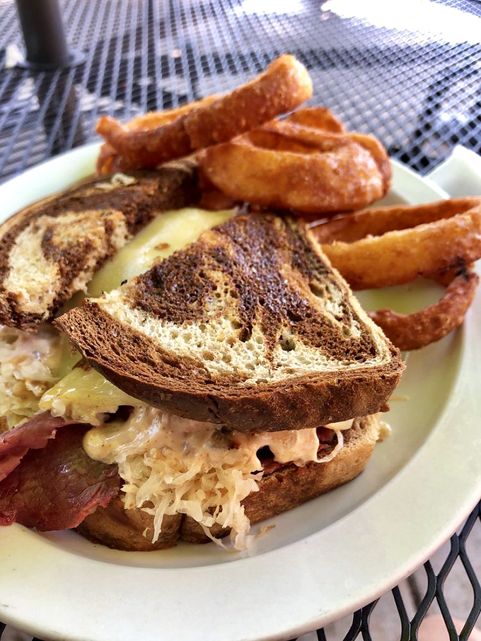 A Reuben sandwich that demands to be photographed first. The perfect marriage of corned beef, sauerkraut, and melty cheese—a holy trinity of deliciousness.