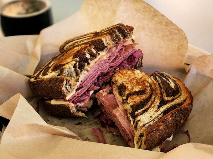This isn't just a sandwich; it's a masterpiece on marble rye. Layers of tender meat and melty cheese that would make any deli proud.