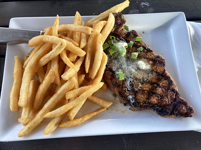 A perfectly blackened ribeye with a side of fries that makes you wonder why anyone would ever eat anything else.