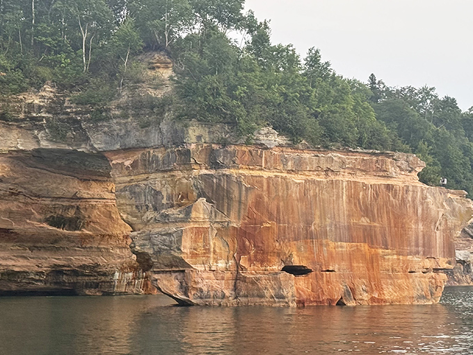 These towering rock walls showcase millions of years of geological artistry in living color.