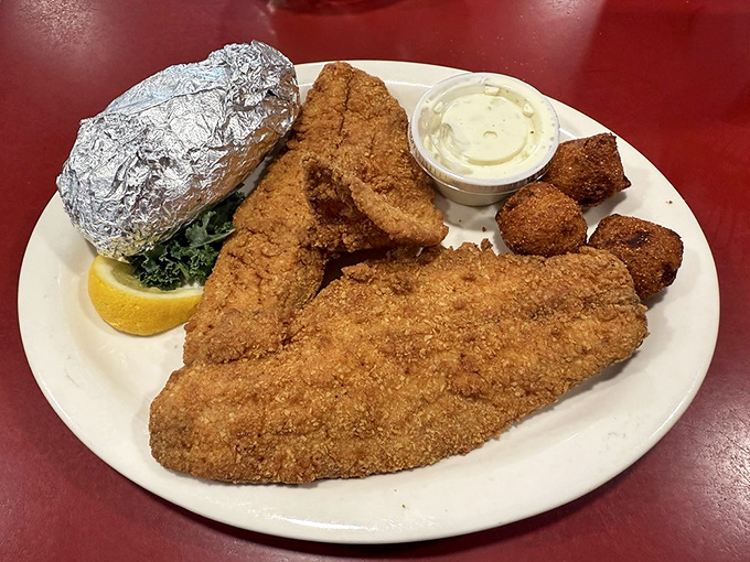 Crispy fried fish with hushpuppies&mdash;the kind of plate that makes you wonder why you ever bother with fancy restaurants.