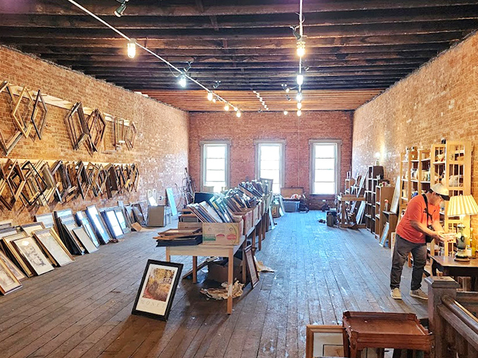 The frame room feels like an art gallery in reverse—hundreds of empty frames waiting to embrace your family photos or flea market paintings.