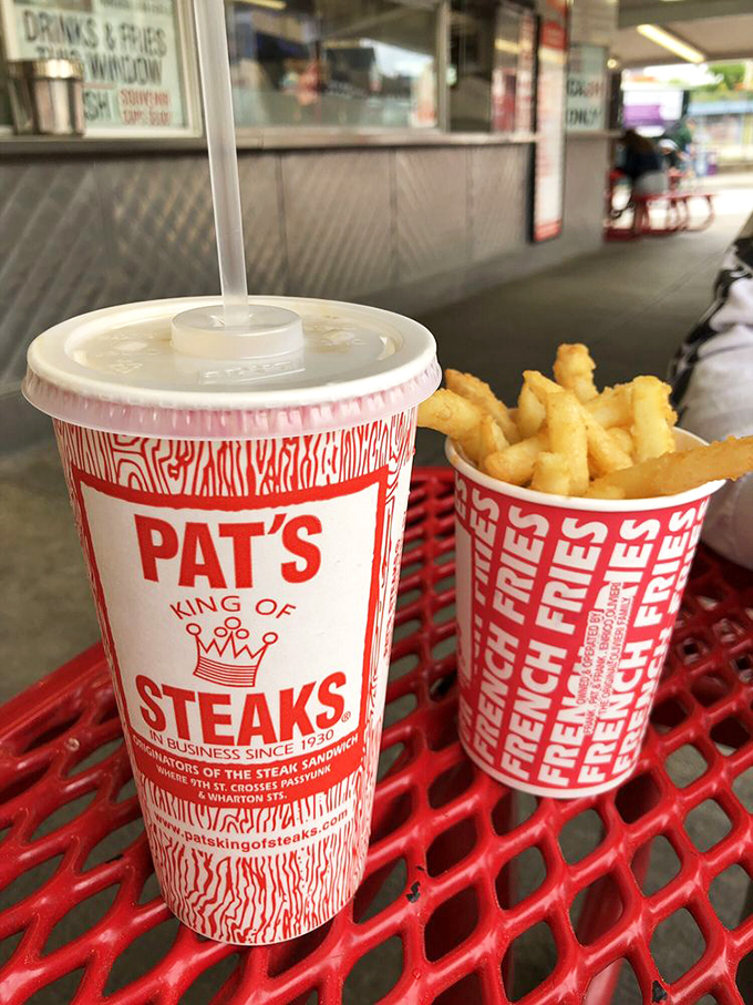 Pat's branded cups: temporary souvenirs of permanent memories. That root beer is working overtime to cut through all that cheesy richness.