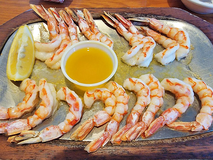 Royal Red shrimp arranged like a sunburst of seafood delight. The melted butter isn't optional&mdash;it's essential for the full experience.
