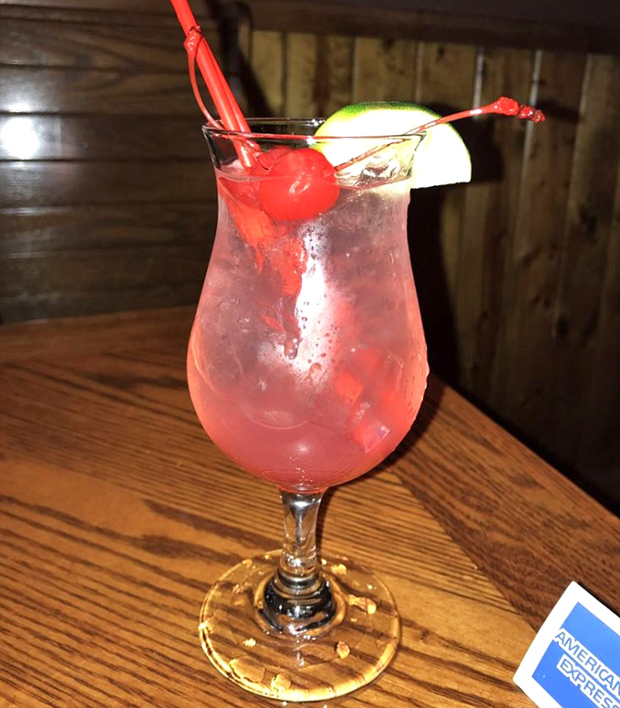 A cocktail that says "vacation mode activated" even if you're just 30 minutes from home. That cherry and lime aren't just garnish &ndash; they're a promise of good times ahead.