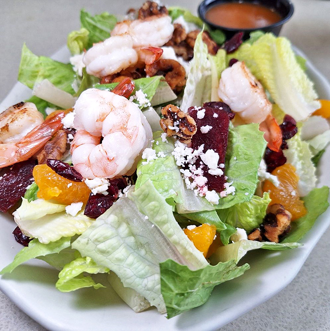 A salad that actually excites &ndash; crisp greens playing host to plump shrimp, tangy cheese, and colorful additions that make vegetables feel like the main event.