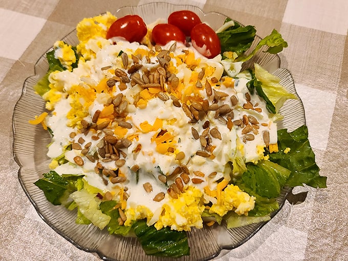 A salad that doesn't apologize for being healthy. Those sunflower seeds add the perfect crunch to balance the creamy dressing.