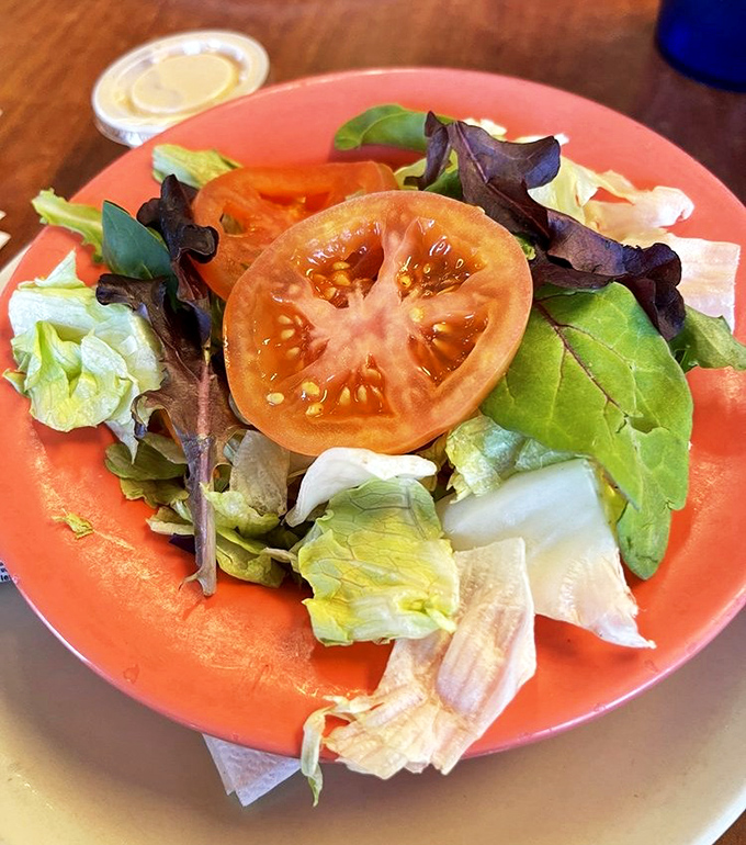 Even the salad at Bobbie's has a straightforward honesty to it&mdash;fresh ingredients on a coral plate that says, "Yes, we have vegetables too."