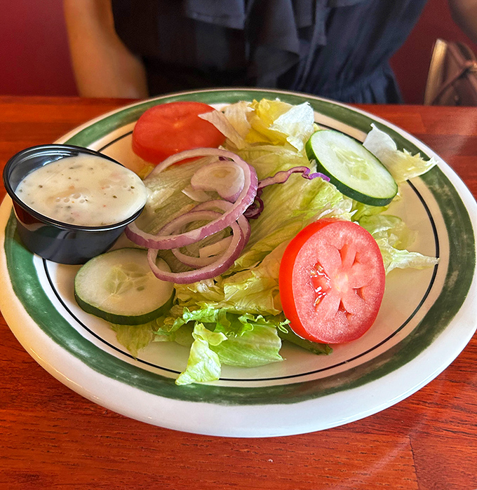 A house salad that knows its role&mdash;fresh, crisp, and ready to provide the illusion that you're making healthy choices before your steak arrives.