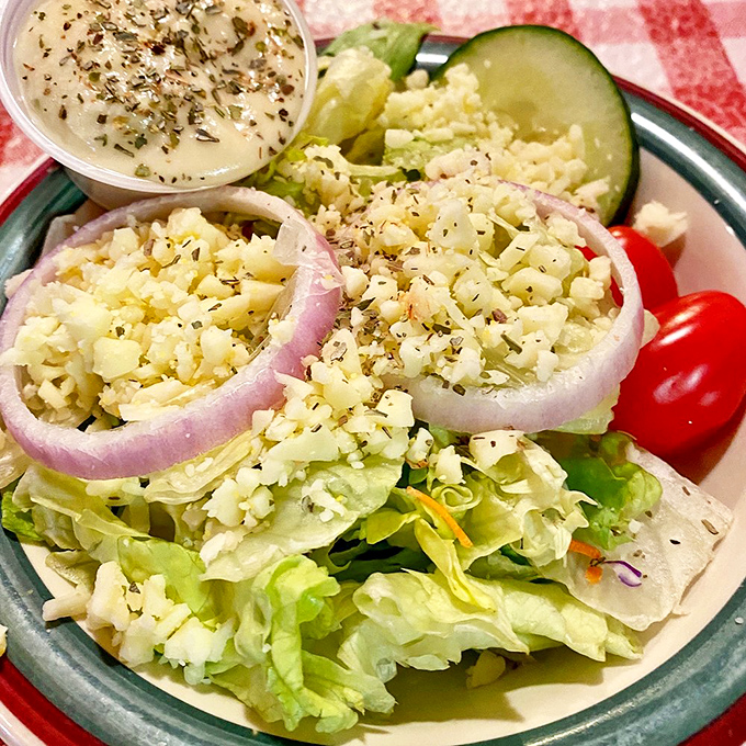 A proper Italian salad with crisp lettuce, red onion rings, and house dressing. The side dish that somehow makes you feel virtuous while still being delicious.