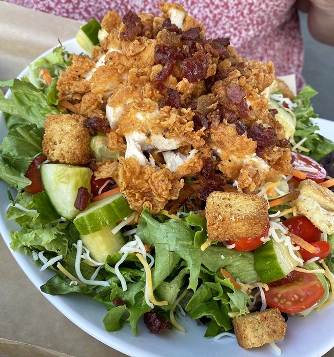 Even their salad gets the royal treatment &ndash; crispy chicken perched atop fresh greens with bacon bits playing the role of crunchy confetti.