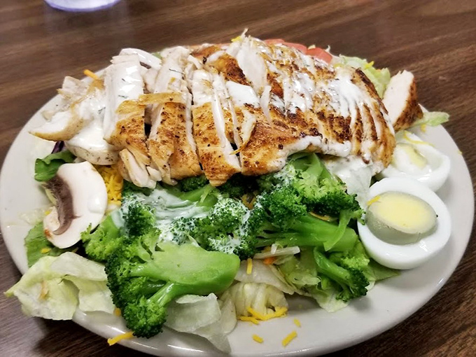 Their grilled chicken salad proves vegetables can be more than an obligation—especially when topped with perfectly seasoned protein.