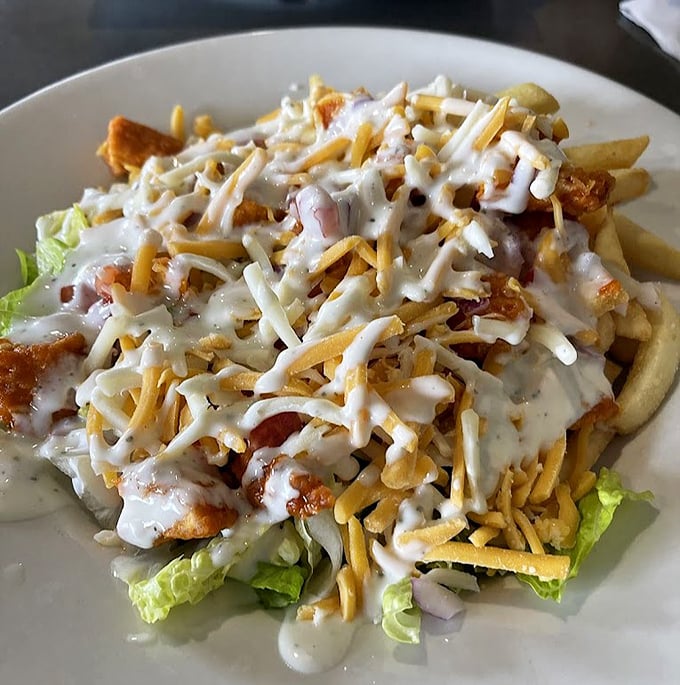 Not just any salad&mdash;a loaded masterpiece with crisp lettuce, seasoned chicken, and a shower of cheese. Proof that diners can do fresh and indulgent in the same dish.