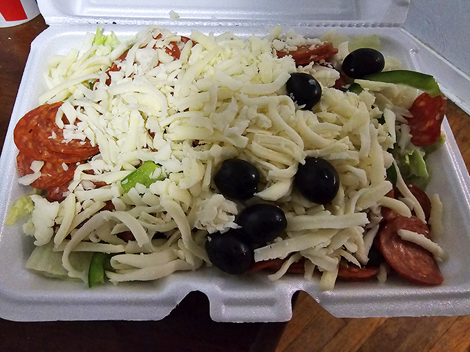 A salad that doesn't apologize for being a salad. Fresh, vibrant, and loaded with enough cheese to remind you you're still in a pizzeria.