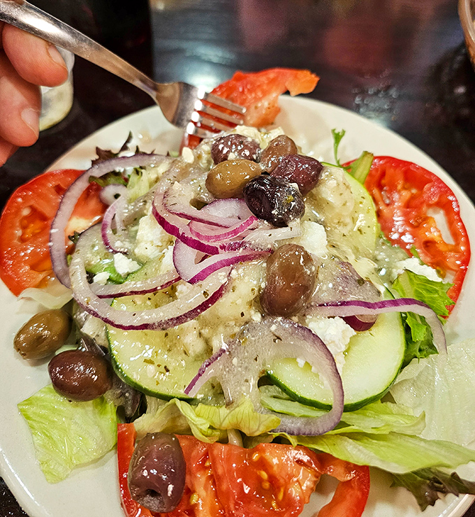 A Greek salad that brings Mediterranean sunshine to South Carolina – those olives aren't just garnish, they're little flavor bombs.