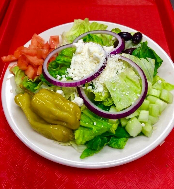 A Greek salad that proves vegetables can have personality too. Those pepperoncini are the character actors in this fresh ensemble.