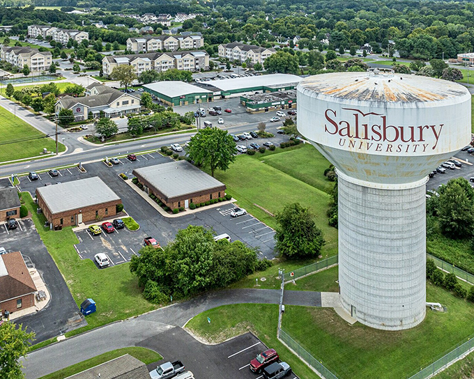 The Salisbury University water tower stands like a beacon of knowledge—or at least a reminder of where to find the campus bookstore.