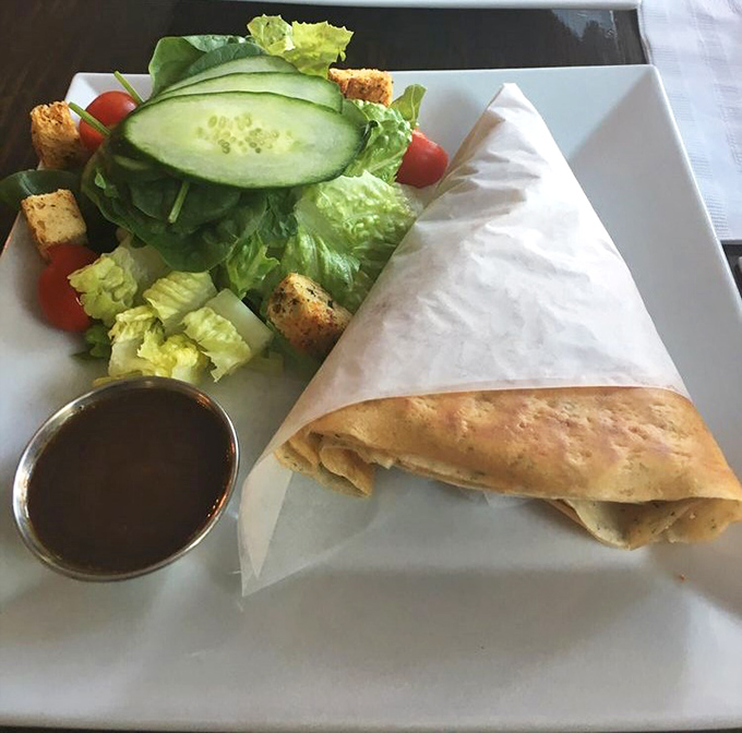The salmon crepe arrives with a side salad that's actually worth eating. Fresh, vibrant, and wrapped with the precision of origami.