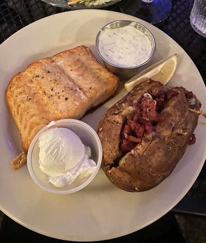 Salmon that didn't sacrifice its life in vain, paired with a loaded potato that's dressed for a night out.