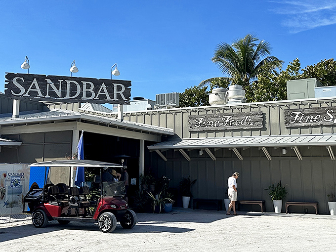 The Sandbar's sign promises exactly what you want on vacation: fine food with your toes in the actual sand, not just metaphorically speaking.