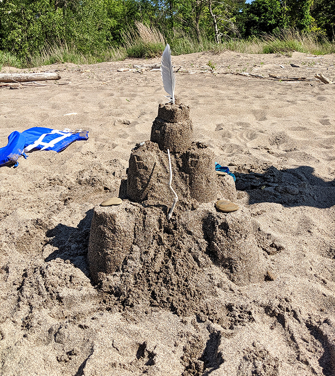 Every great beach day deserves a great sandcastle&mdash;this feather-topped creation wouldn't survive high tide, but it's architectural ambition is admirable.