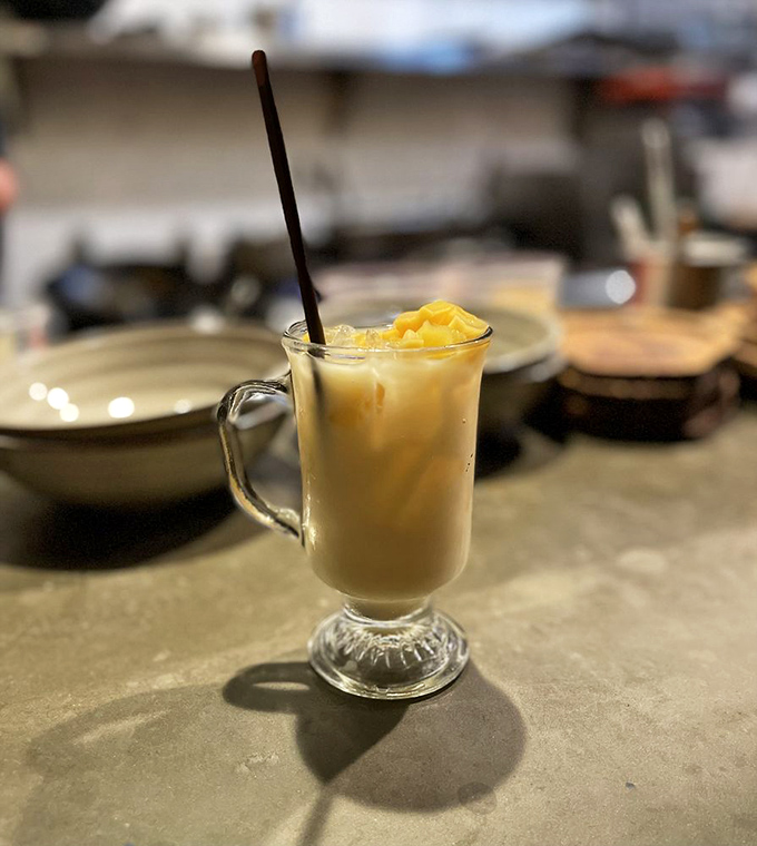 This sangria looks like liquid sunshine decided to take a tropical vacation in your glass.