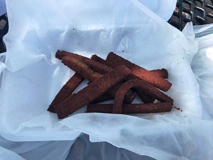 These aren't just fries &ndash; they're the supporting actors that deserve their own Oscar. Crispy, seasoned perfection on wax paper.