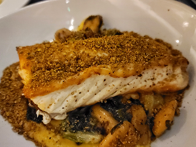Crispy-skinned sea bass perched atop mushrooms like culinary royalty&mdash;proof that simplicity executed perfectly is the highest form of cooking.