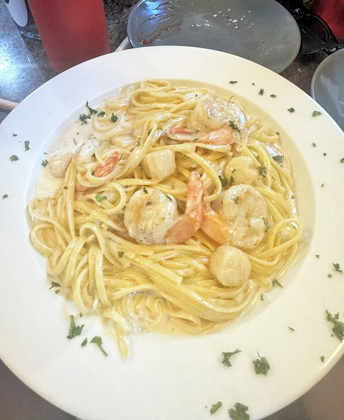 Creamy Alfredo sauce coating tender shrimp and scallops over linguine&mdash;comfort food that feels like a warm Italian hug.