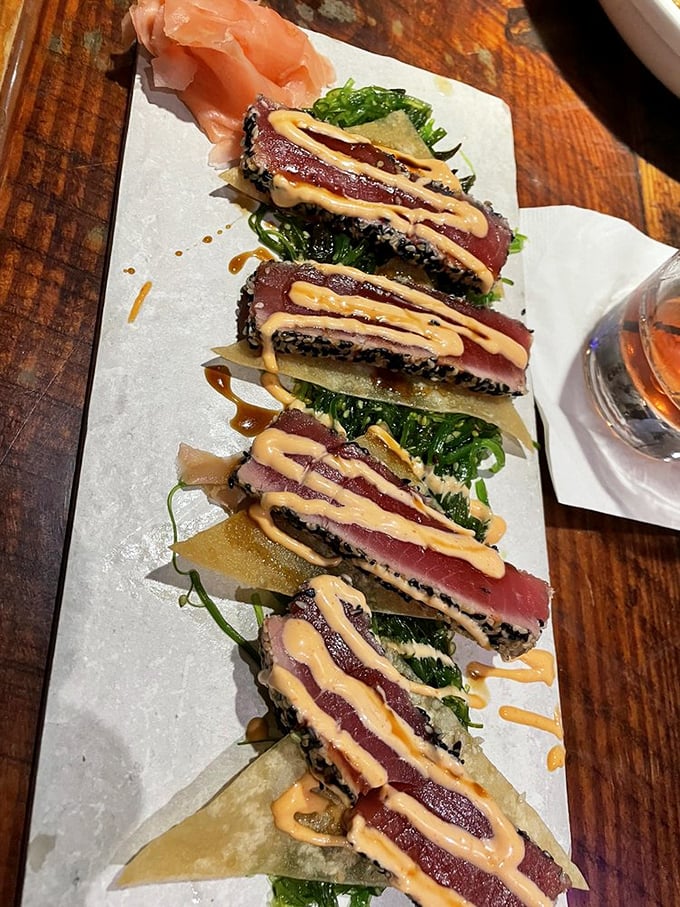 Seared tuna that's dressed to impress&mdash;ruby red centers with a sesame crust and that sauce drizzled like edible modern art.