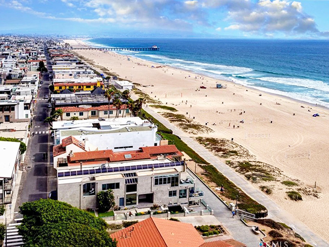 A bird's-eye view of Manhattan Beach's coastline reveals the perfect grid of paradise, where every street leads to that blue horizon.