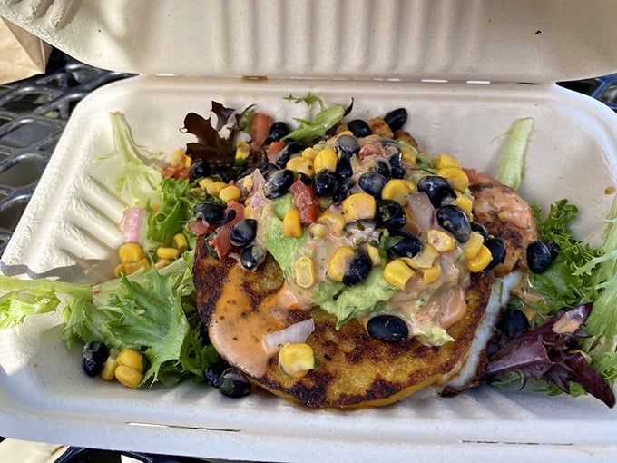 This shrimp arepa is what happens when corn dreams big. The black beans and corn create a sweet-savory symphony that Florida does surprisingly well.