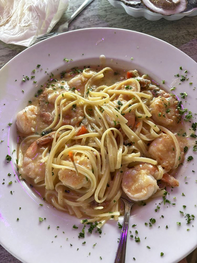 Shrimp scampi that would make an Italian grandmother nod in approval. Those plump shrimp are practically doing the backstroke in buttery, garlicky heaven.