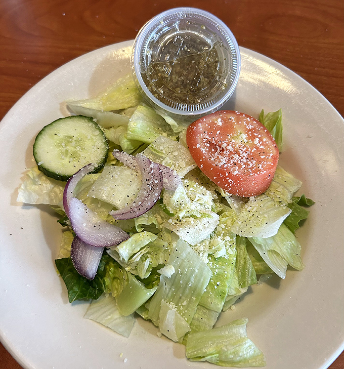 A side salad that actually deserves attention&mdash;crisp vegetables, thoughtful composition, and dressing on the side for control freaks like me.