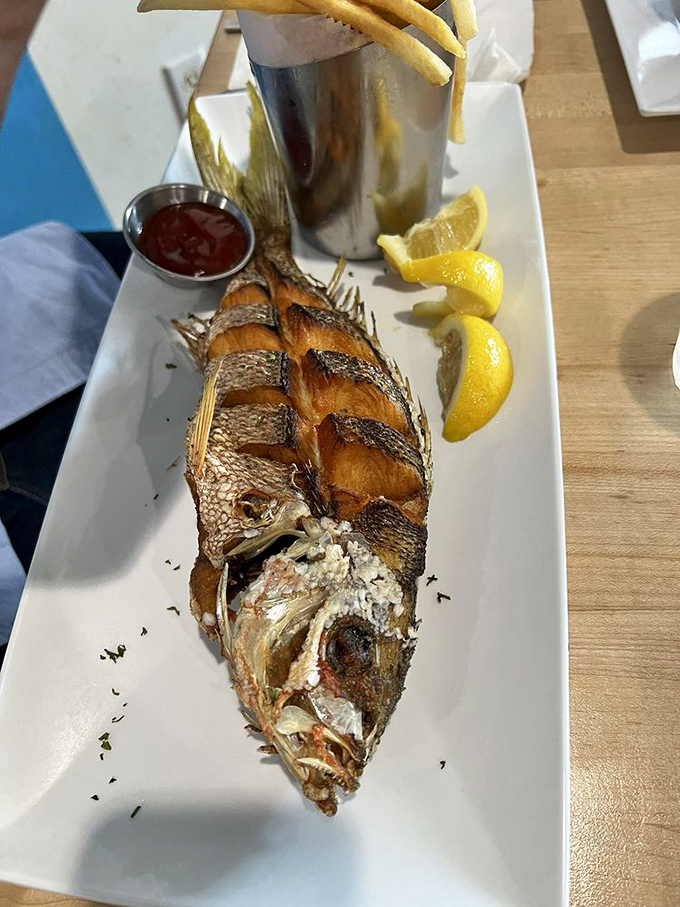 This whole fried snapper stares back as if to say, "Yes, I'm delicious and I know it." The ultimate seafood power move.